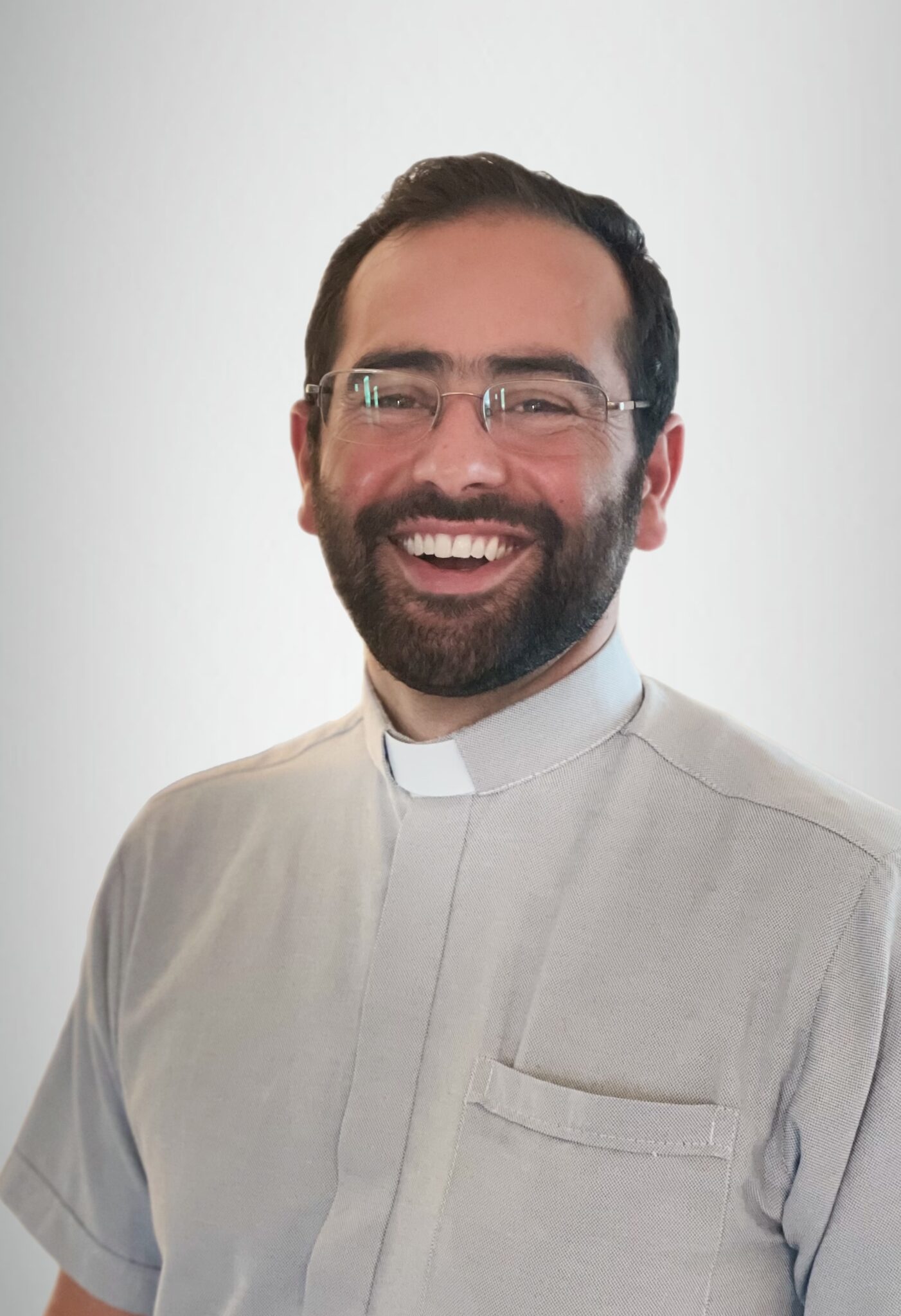 Rev. Christian Chami – Holy Cross Catholic Church